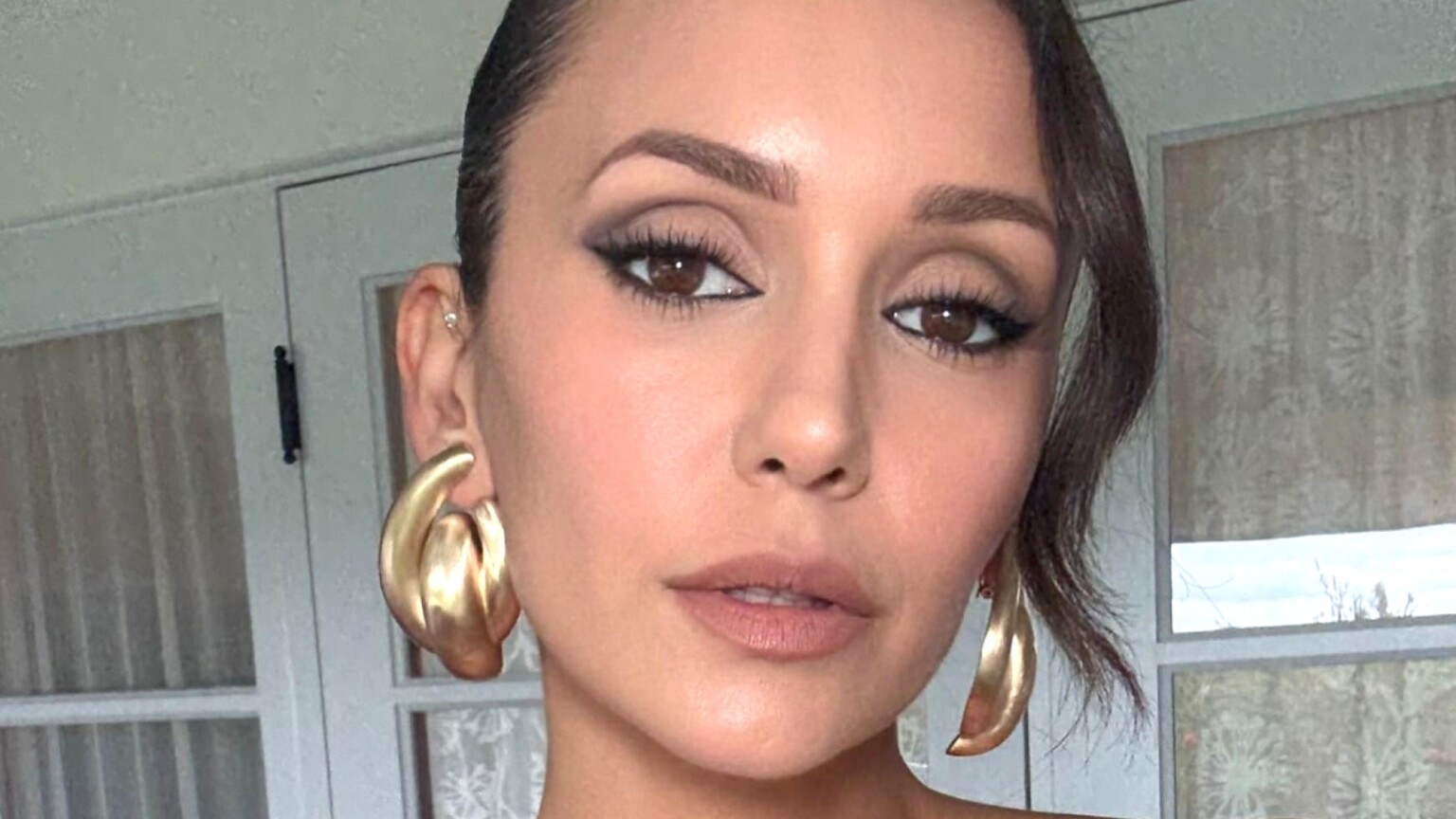 At 37, Nina Dobrev proves that the slip dress is a red carpet classic